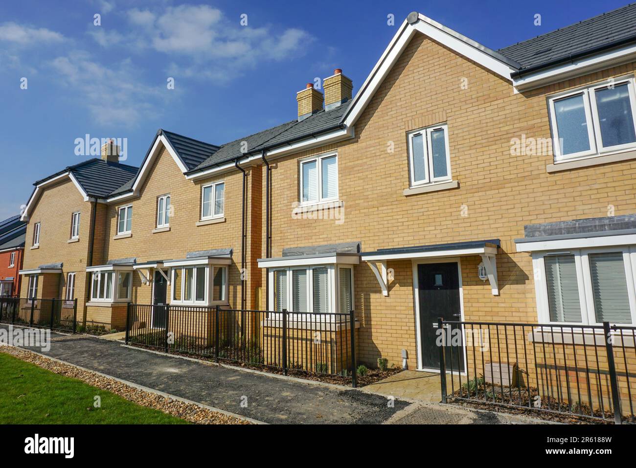 A row of new build houses in the UK. Terraced modern family homes ...