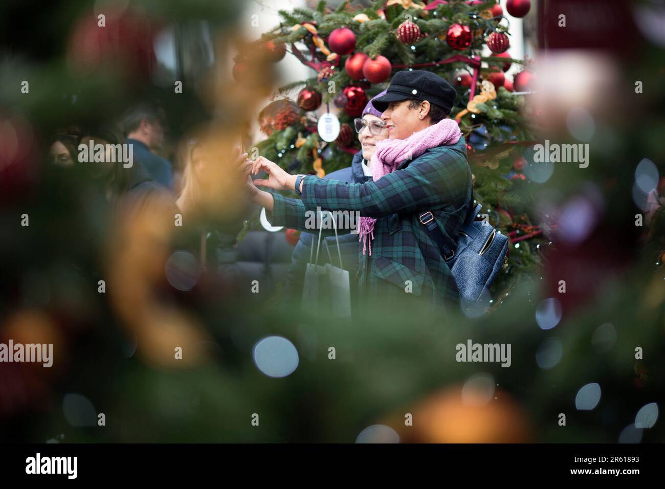 Christmassy decorations and outfits are seen in Covent Garden, central ...