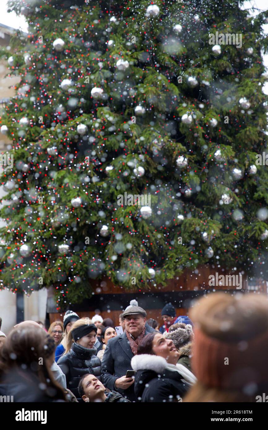 Christmassy decorations and artificial snow flakes are seen in Covent ...