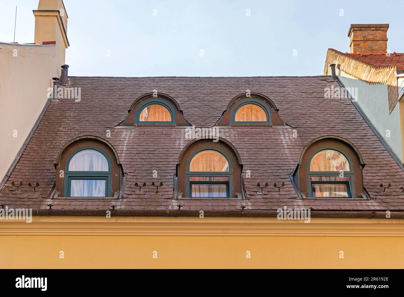 Arch Dormer Windows in Attic Two Level Roof House Stock Photo - Alamy