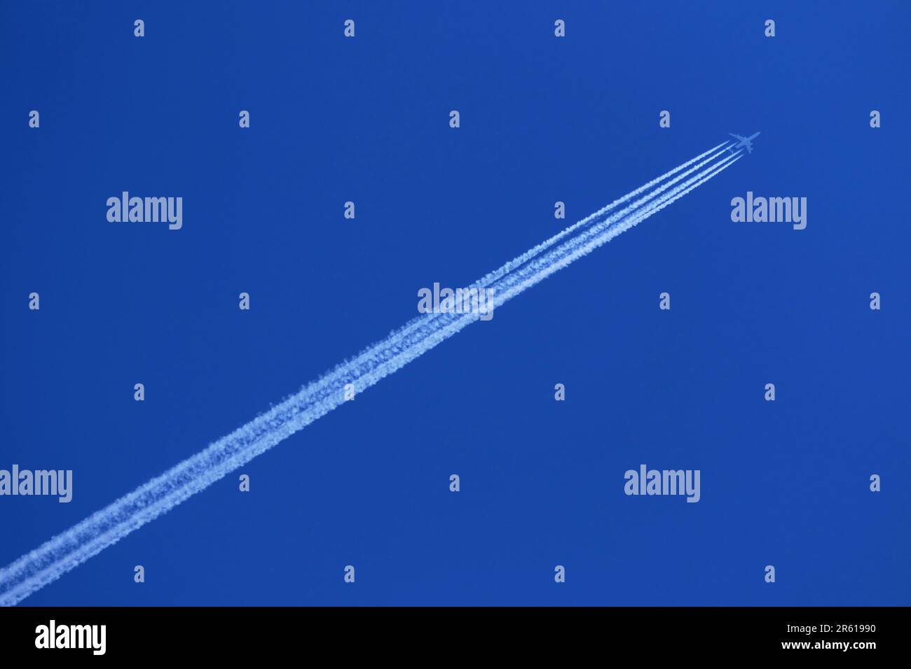 trace from the plane in the blue sky Stock Photo - Alamy