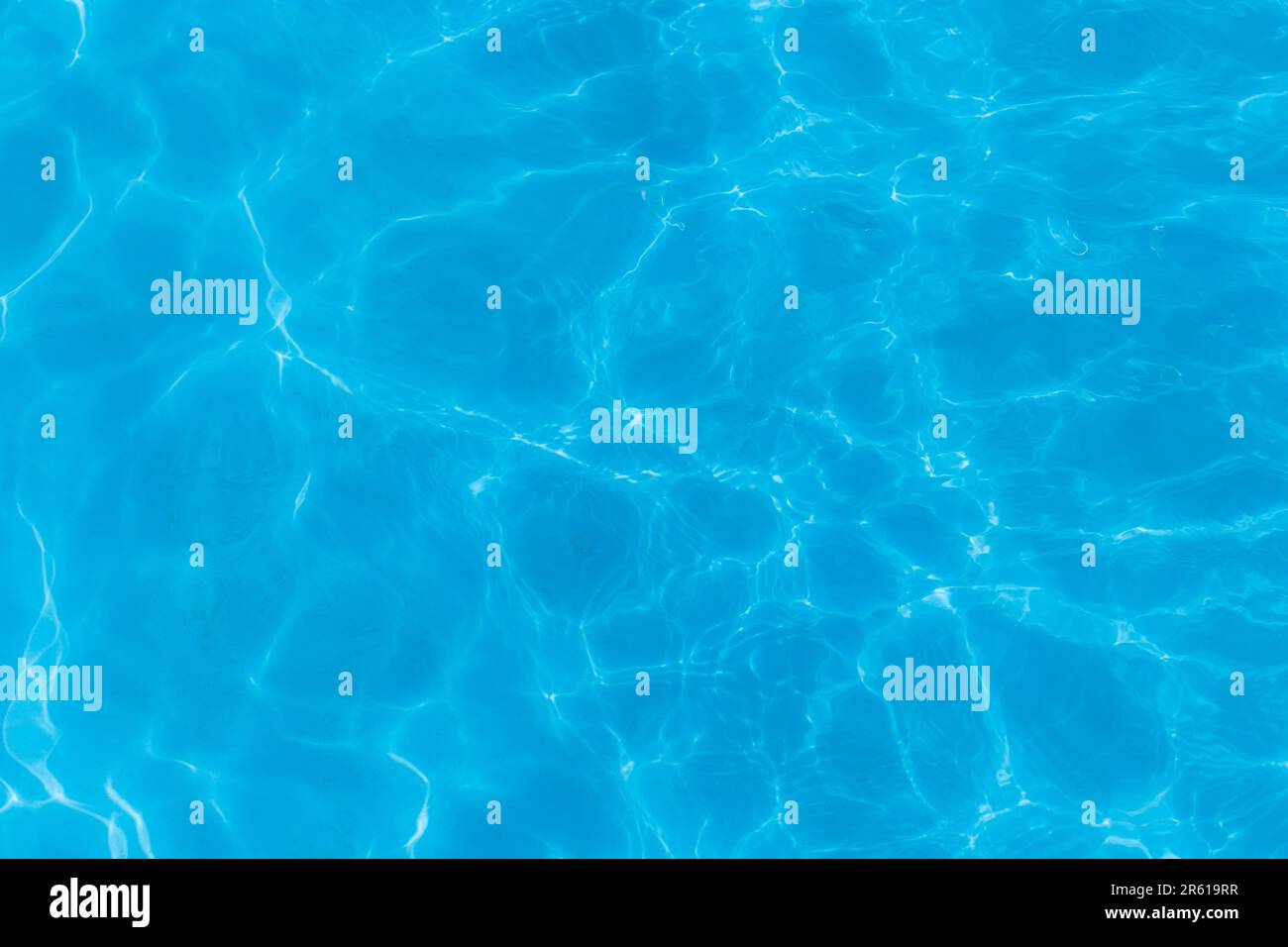 Blue clear pool water with abstract pattern of reflection and wave ...