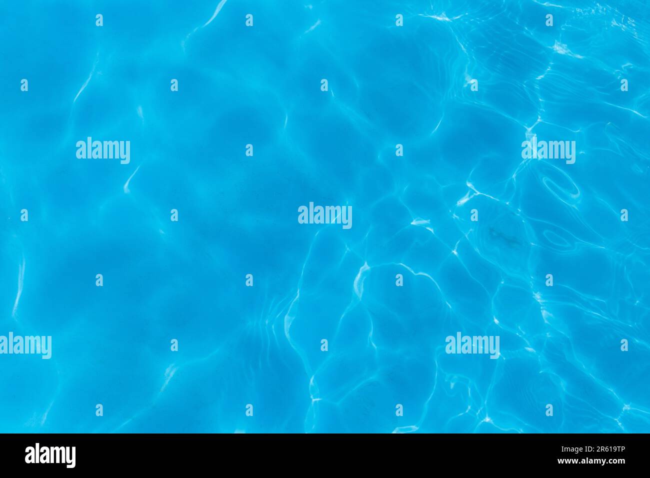Blue clear pool water with abstract pattern of reflection and wave wet ...