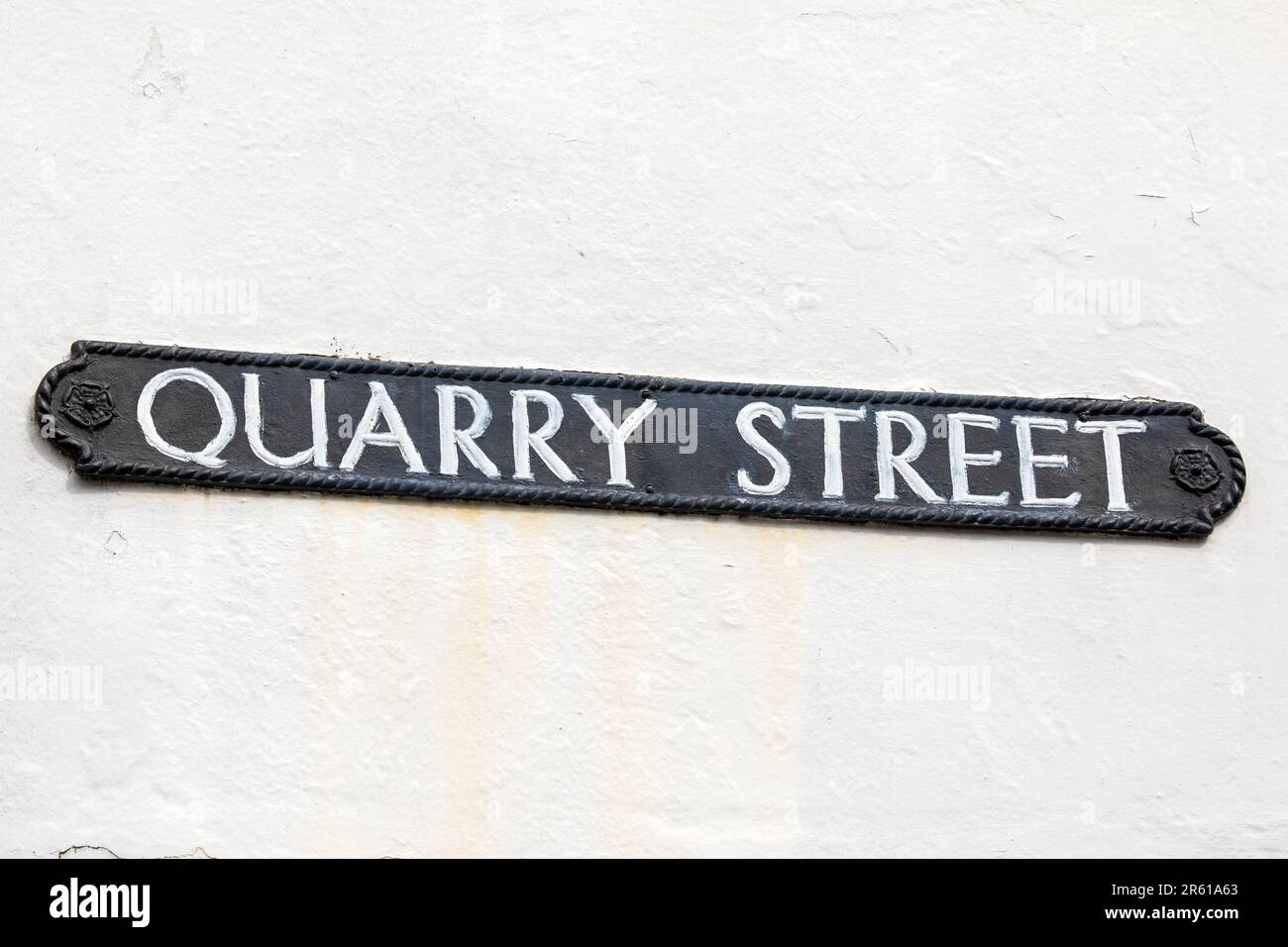 The street sign for Quarry Street, in the historic town of Guildford in ...