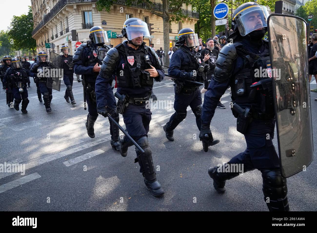 Riot police officers take position during a protest in Paris, France ...