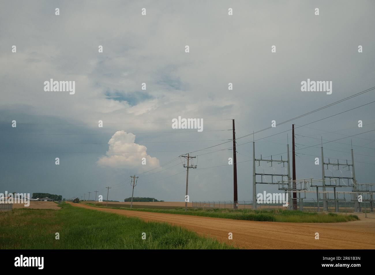 A rural setting showcases an expansive field with numerous utility ...