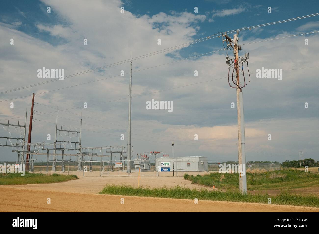 a sunny day showing electrical power lines running over an electrical ...