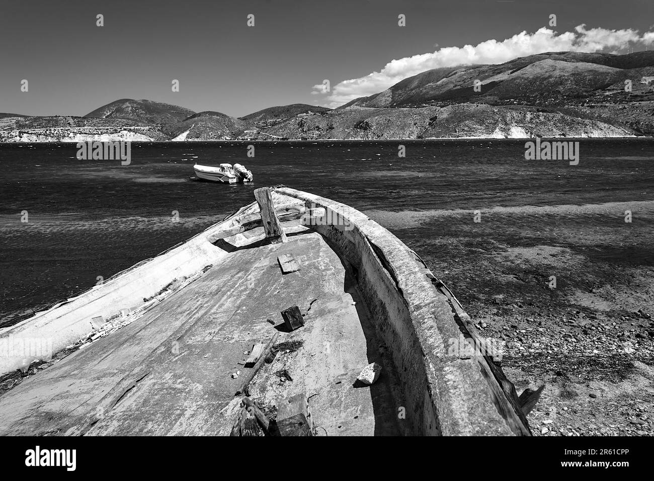 The hull of an old, damaged, boat on the seashore on the island of ...