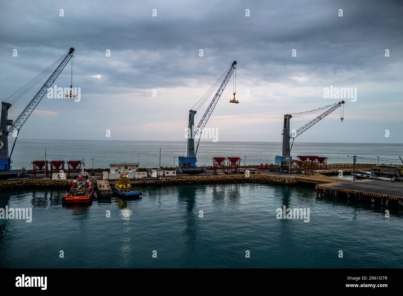 Manta, Ecuador--January 14, 2023. A wide angle backlit shot of threee ...