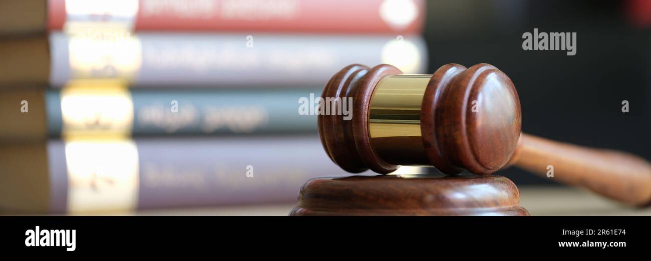 Judge gavel or hammer on sounding block and stack of law books Stock ...