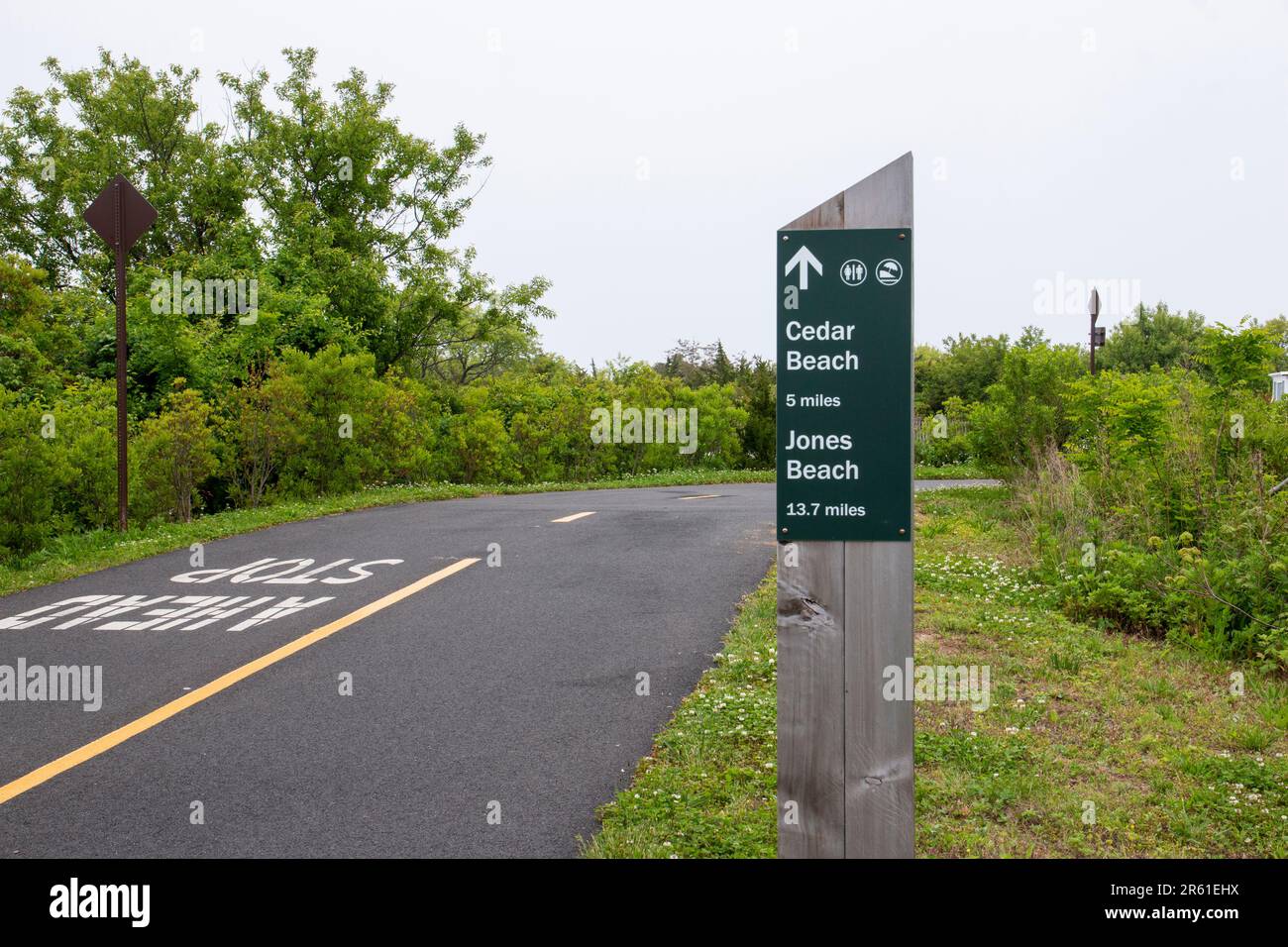 Sign post showing the milage on a bike path to Jones Beach from Captree ...