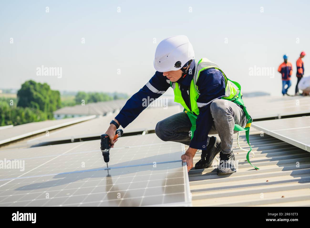 Engineers with safety helmet checking solar system at solar power farm ...