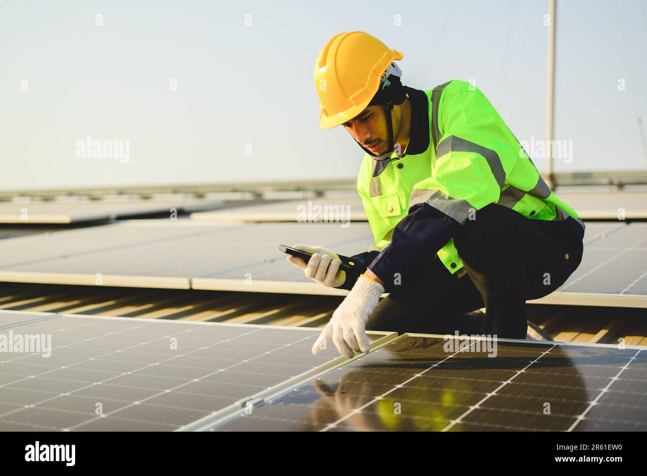 Engineer worker working at solar cell power plant with sunset Stock ...