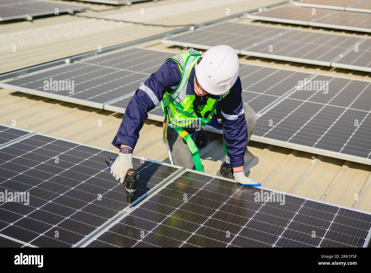 Engineers with safety helmet checking solar system at solar power farm ...