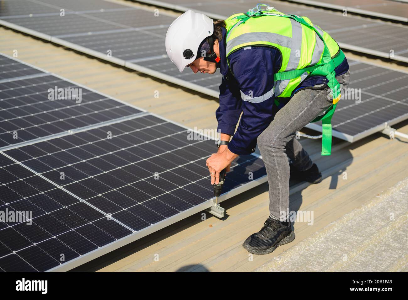Engineers with safety helmet checking solar system at solar power farm ...