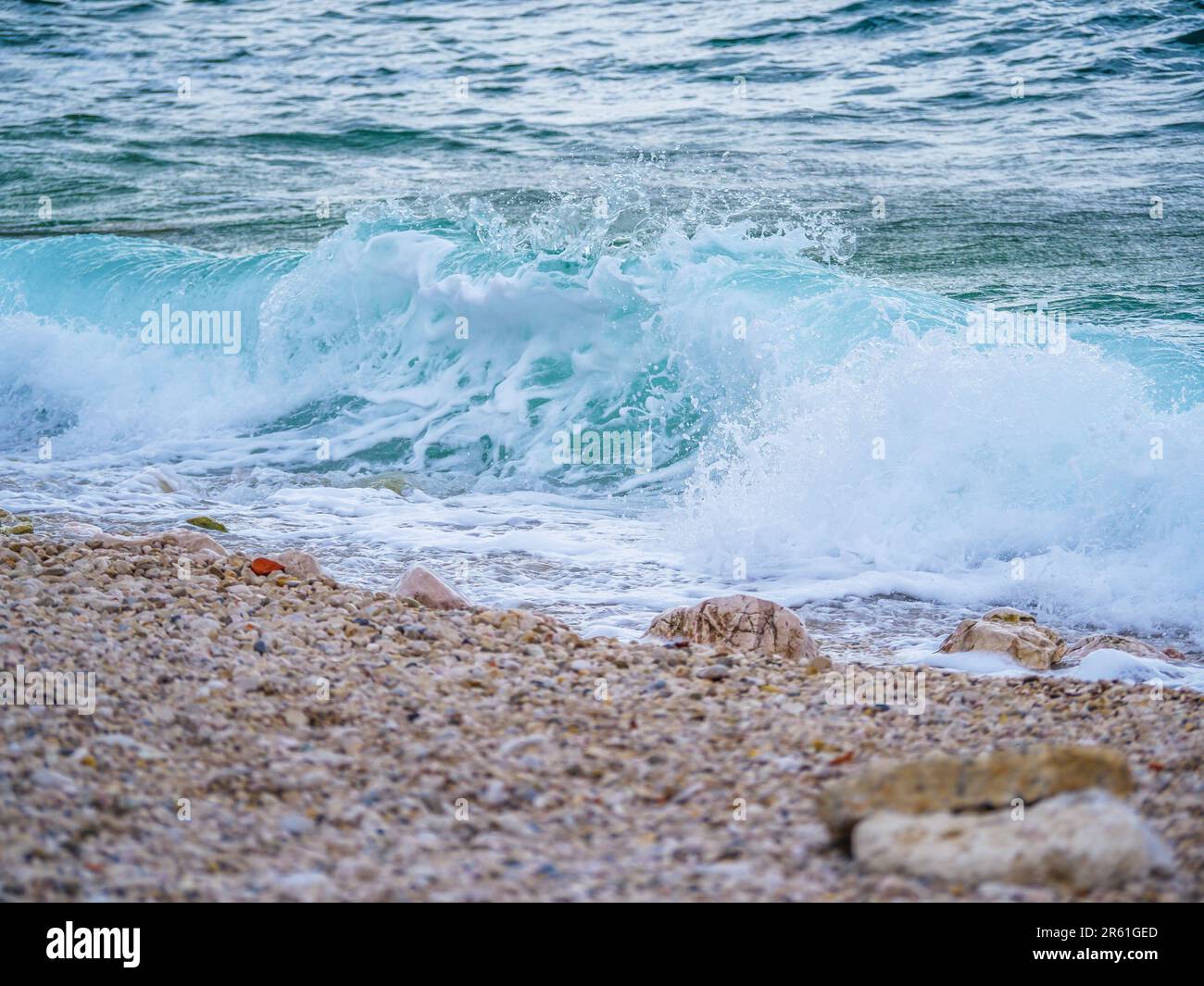 The soft ocean waves with foam on a beach Stock Photo - Alamy