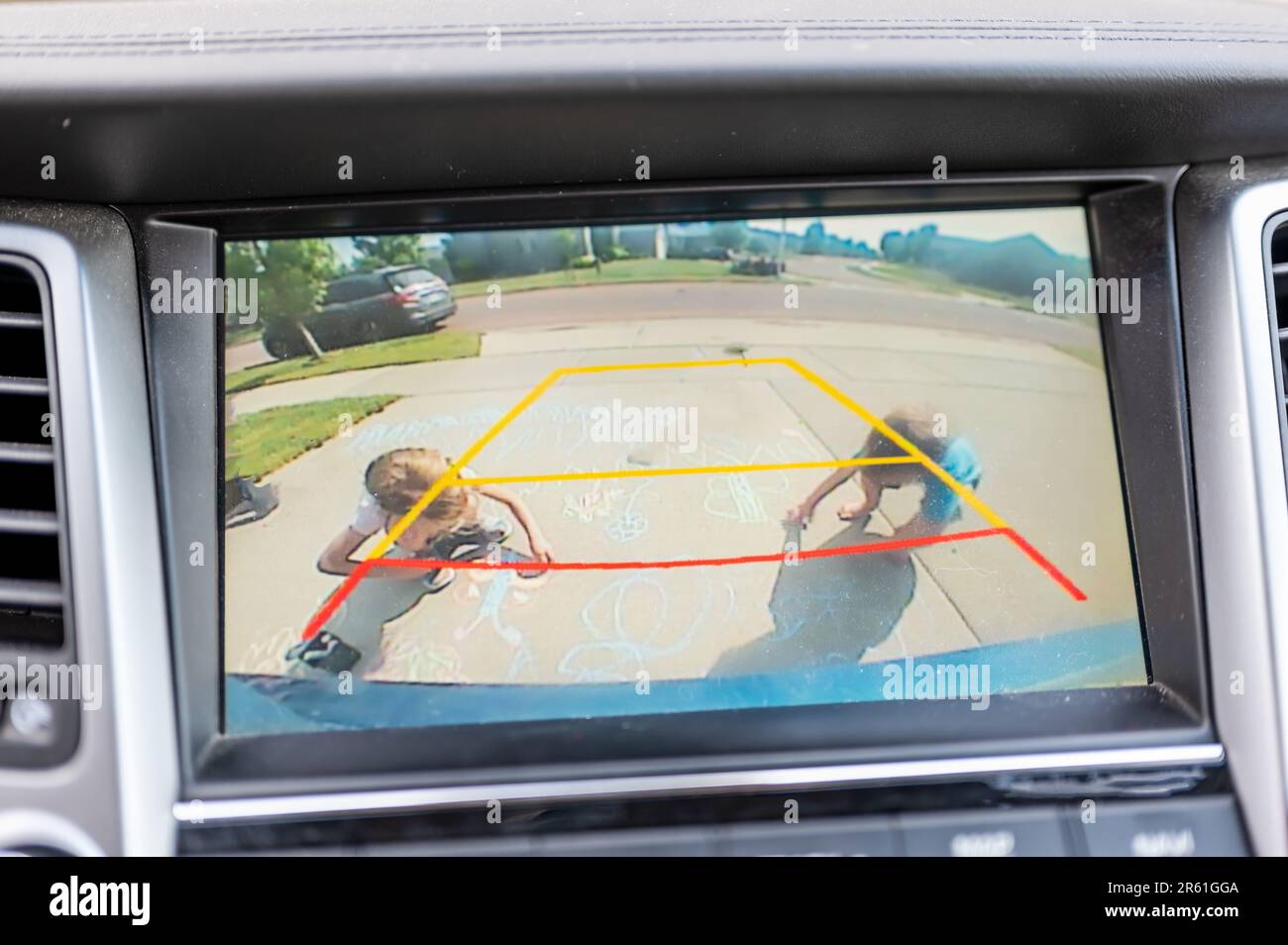 Children seen in a rear view backup camera drawing with chalk Stock ...
