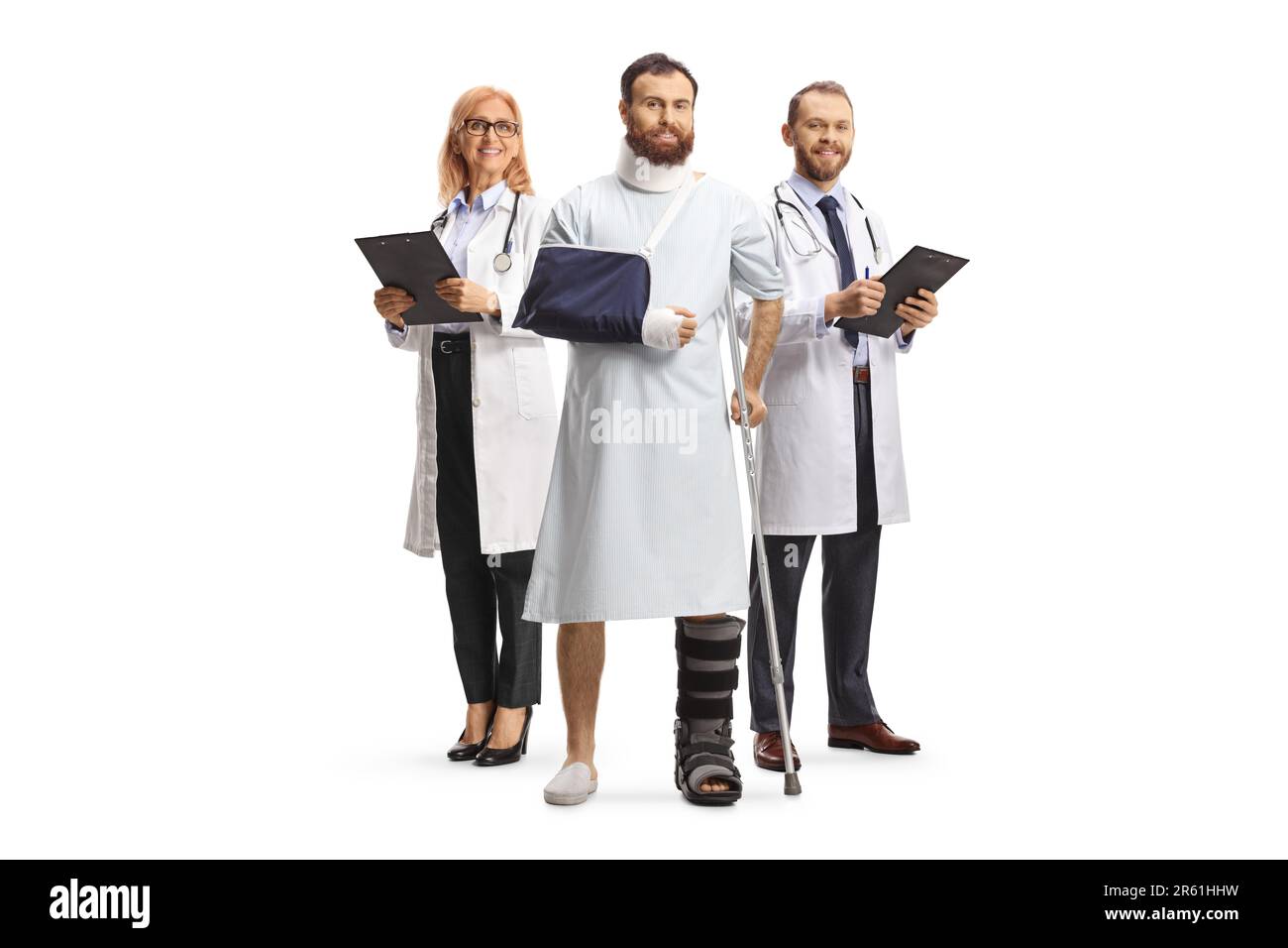 Team of physicians behind a male patient with an orthopedic boot and ...