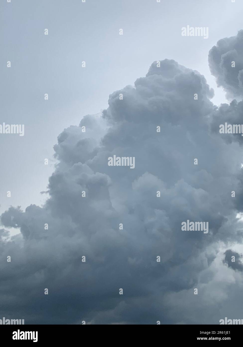 A dramatic sky with an expanse of dark grey clouds Stock Photo - Alamy