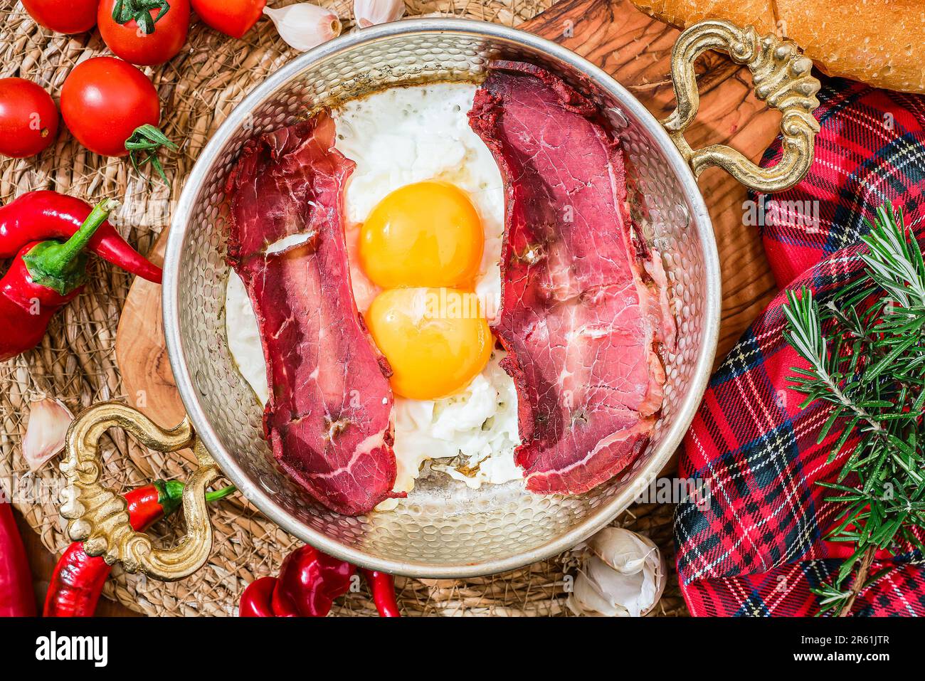 Sliced Turkish bacon pastrima for breakfast, fried beef with eggs ...