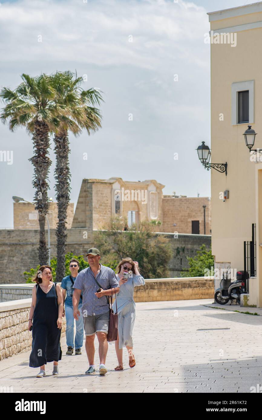 Tourists walking on the ancient walls with medieval Fortress of Saint ...