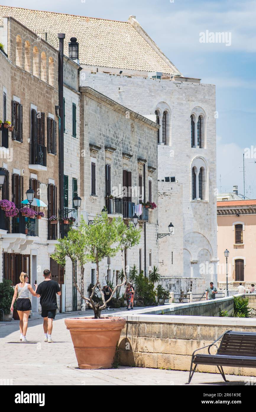 Tourists walking on the ancient walls with Pontifical Basilica or ...