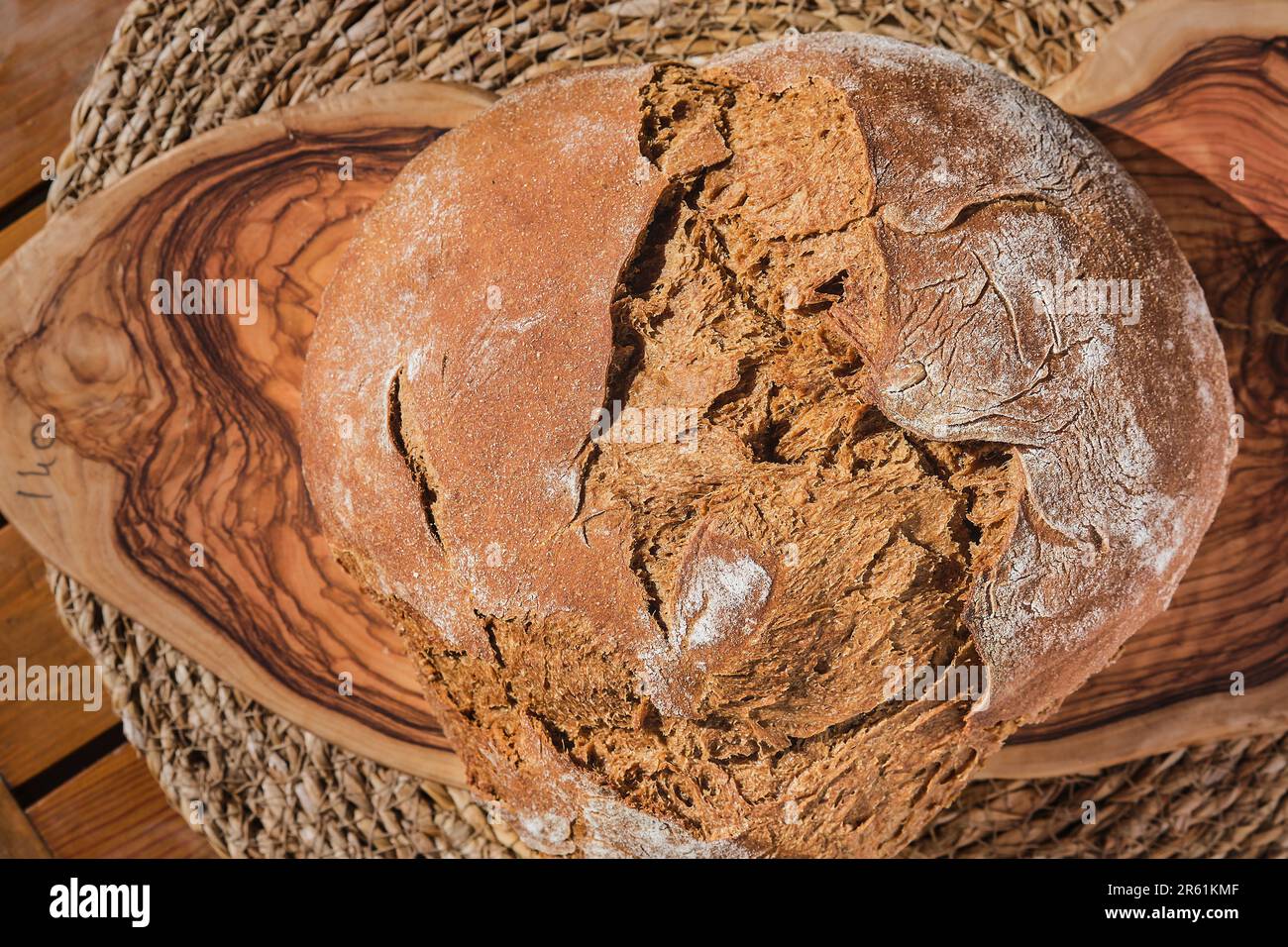 Freshly baked artisan gray bread, top view, whole grain bread on a ...