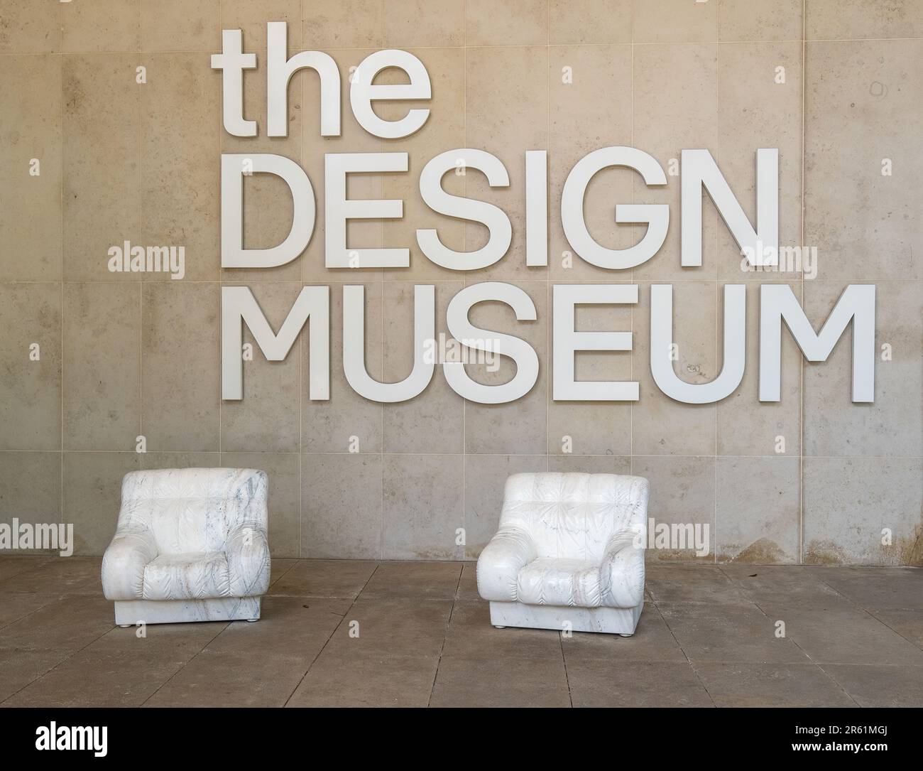 Two modern chairs in front of the entrance of the Design Museum, London ...