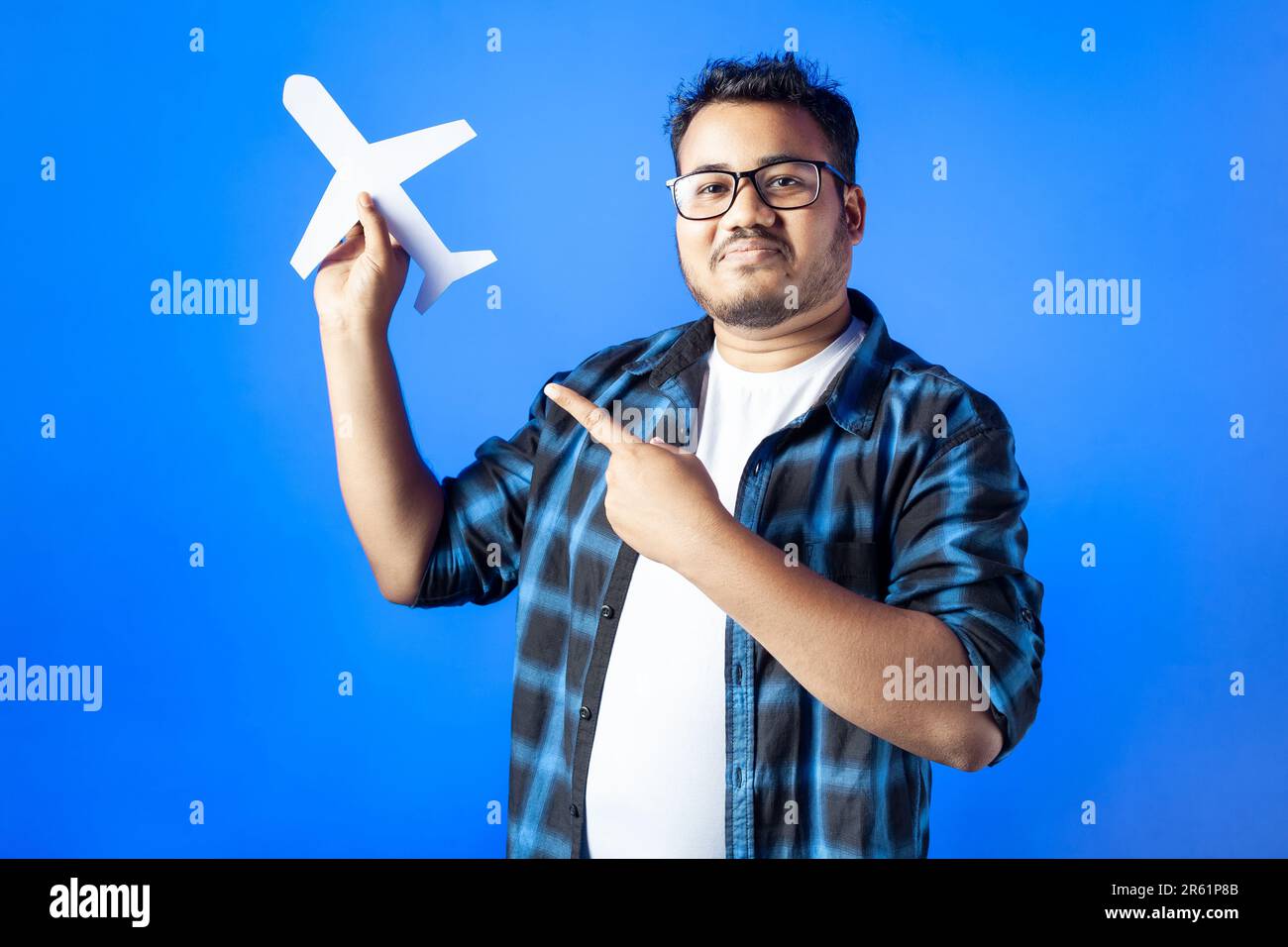 Journey, airplane, Indian ethnicity. Indian young guy holding paper cut ...