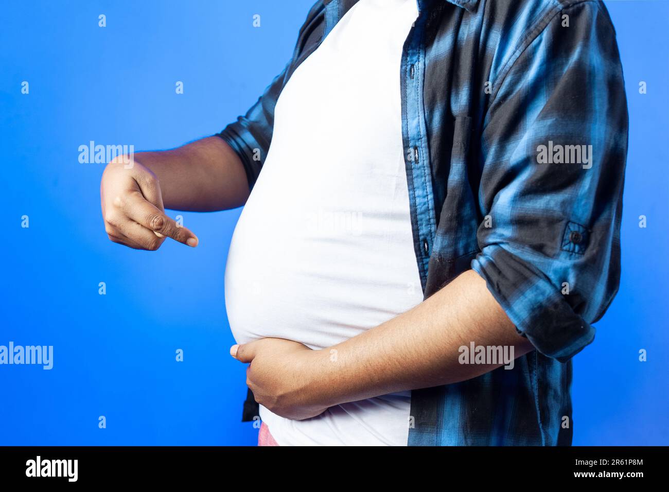 concept of dieting, fitness, body positive. Indian guy showing fat ...