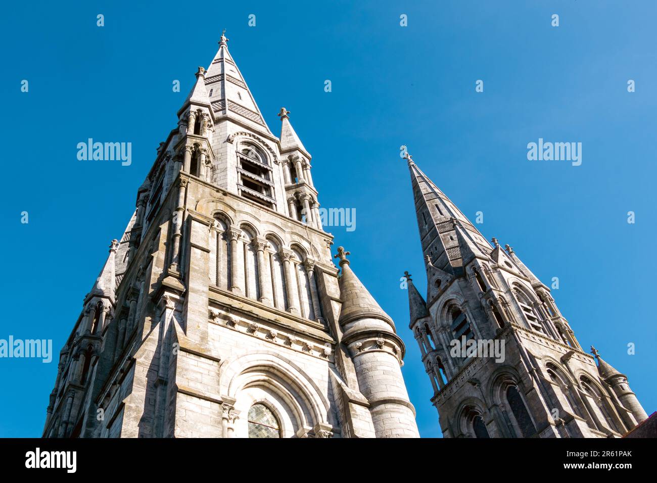 The tall Gothic spire of an Anglican church in Cork, Ireland. Neo ...