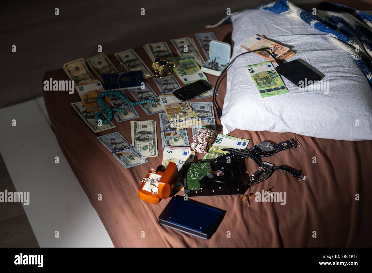 Evidence bag next to dollar banknotes in a crime investigation unit ...
