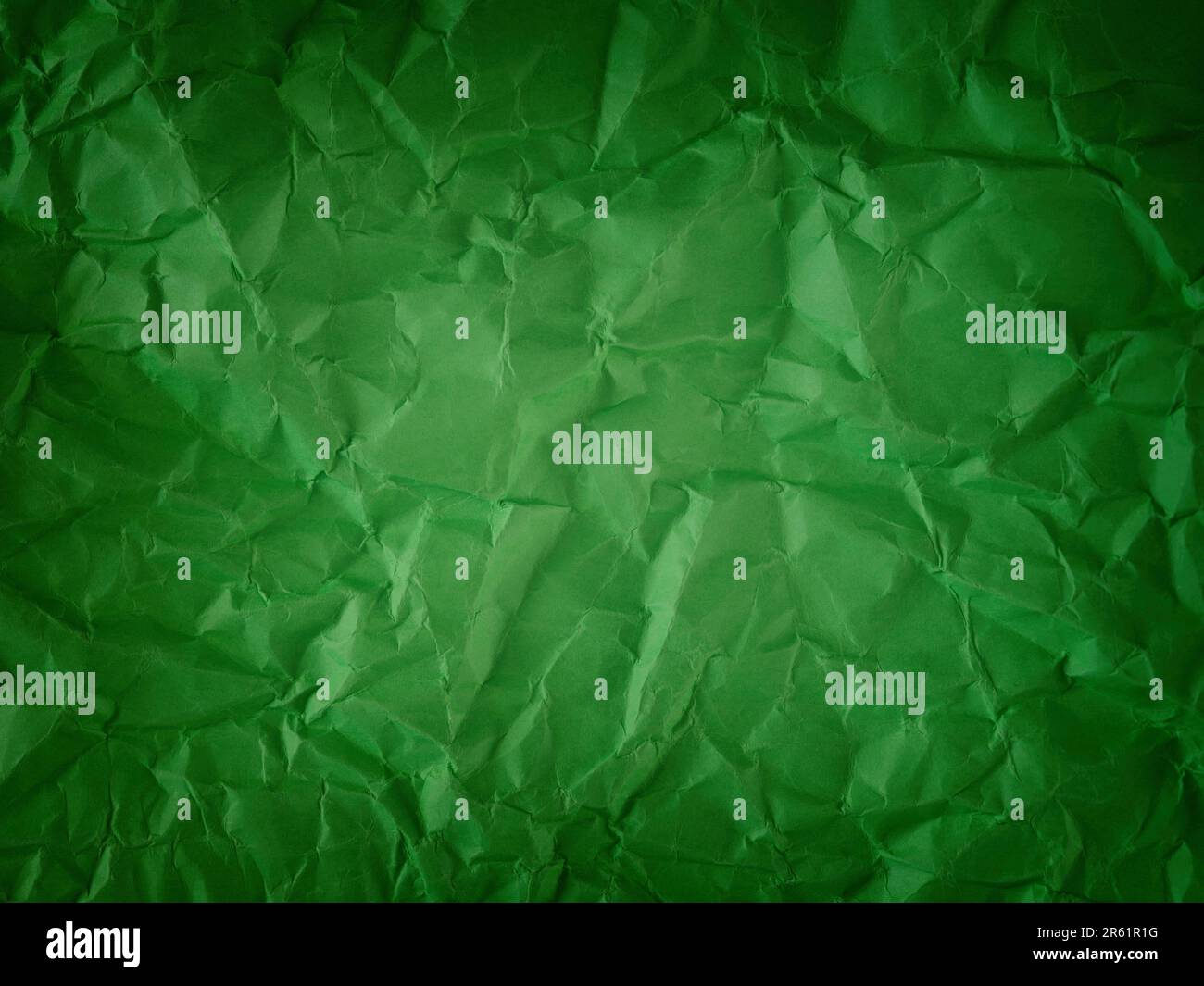 A crumpled green paper background. Close up Stock Photo - Alamy
