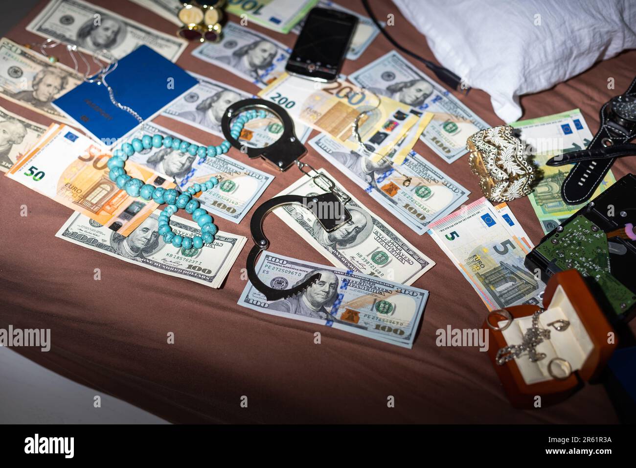 Evidence bag next to dollar banknotes in a crime investigation unit ...
