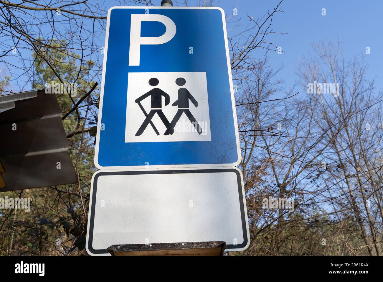 Blue parking sign for hiker vehicles in the park with space for text ...