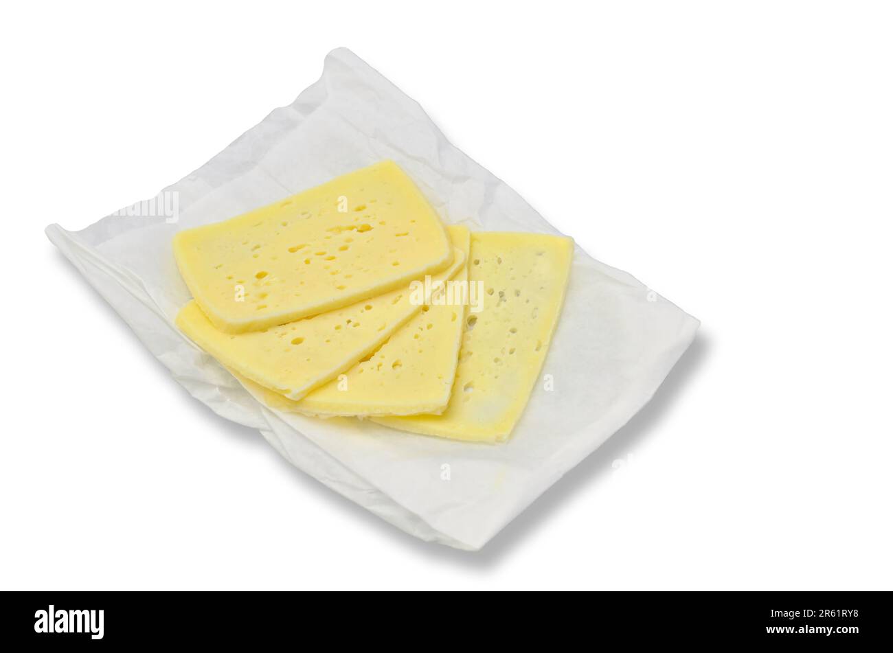 slices of Tilsit cheese on sandwich paper, close-up, isolated on white ...
