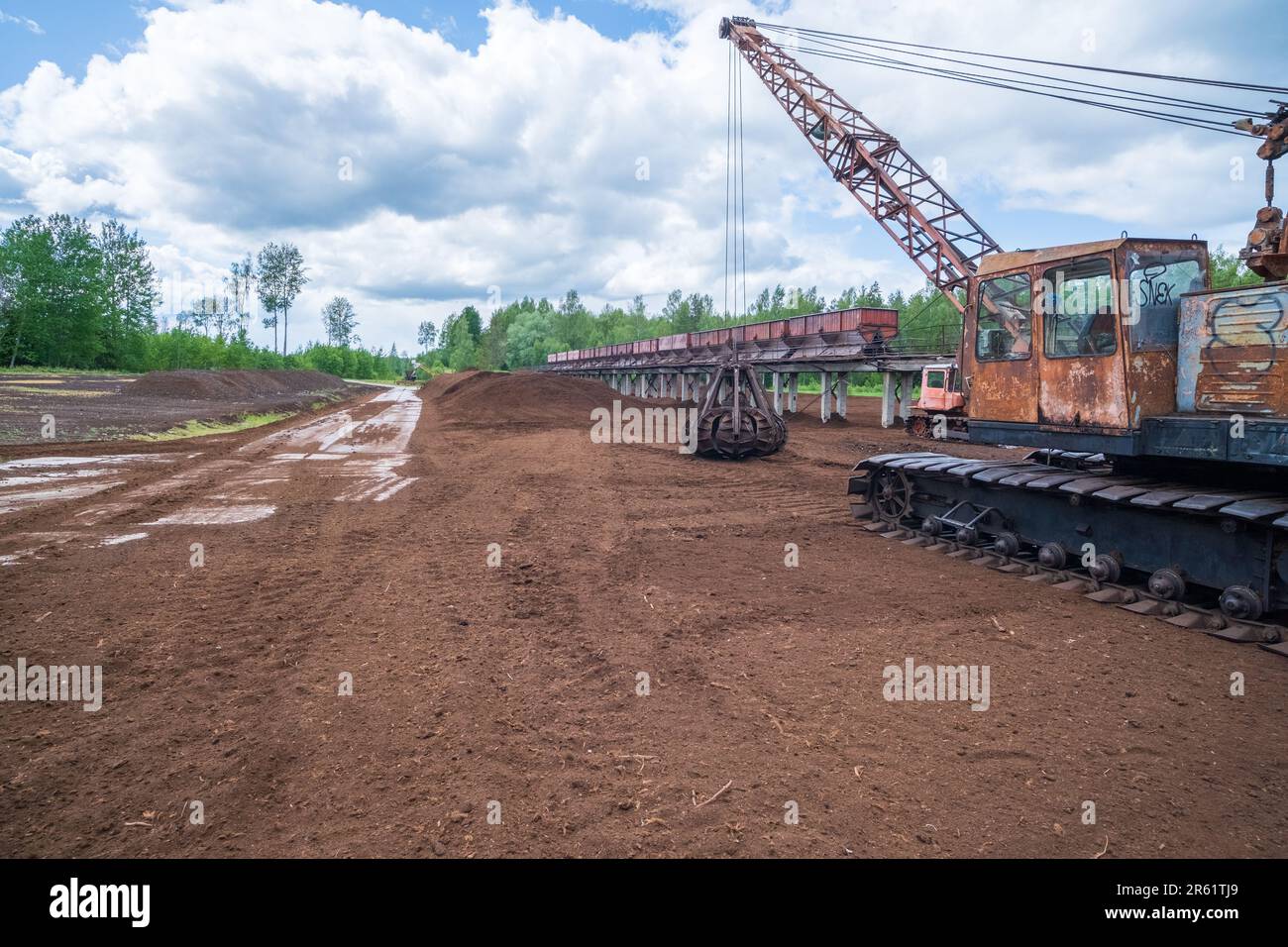 Excavator for stacking peat. Large dome bucket for loading into train ...