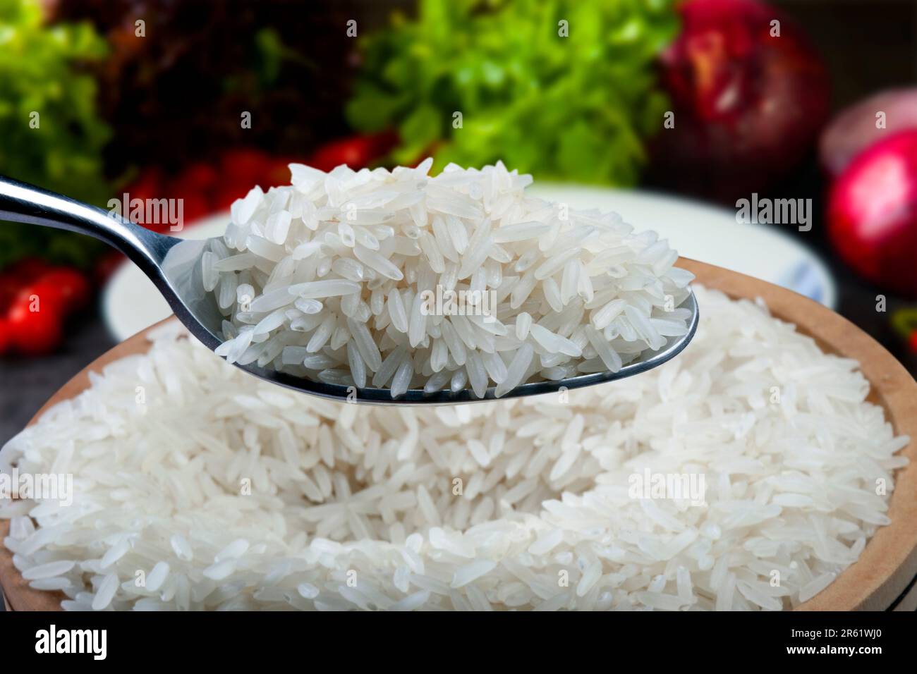 spoon with white rice Stock Photo - Alamy