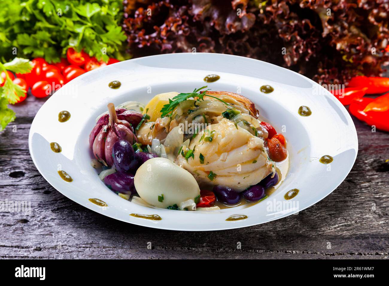 Cod with eggs olives and vegetables Stock Photo - Alamy