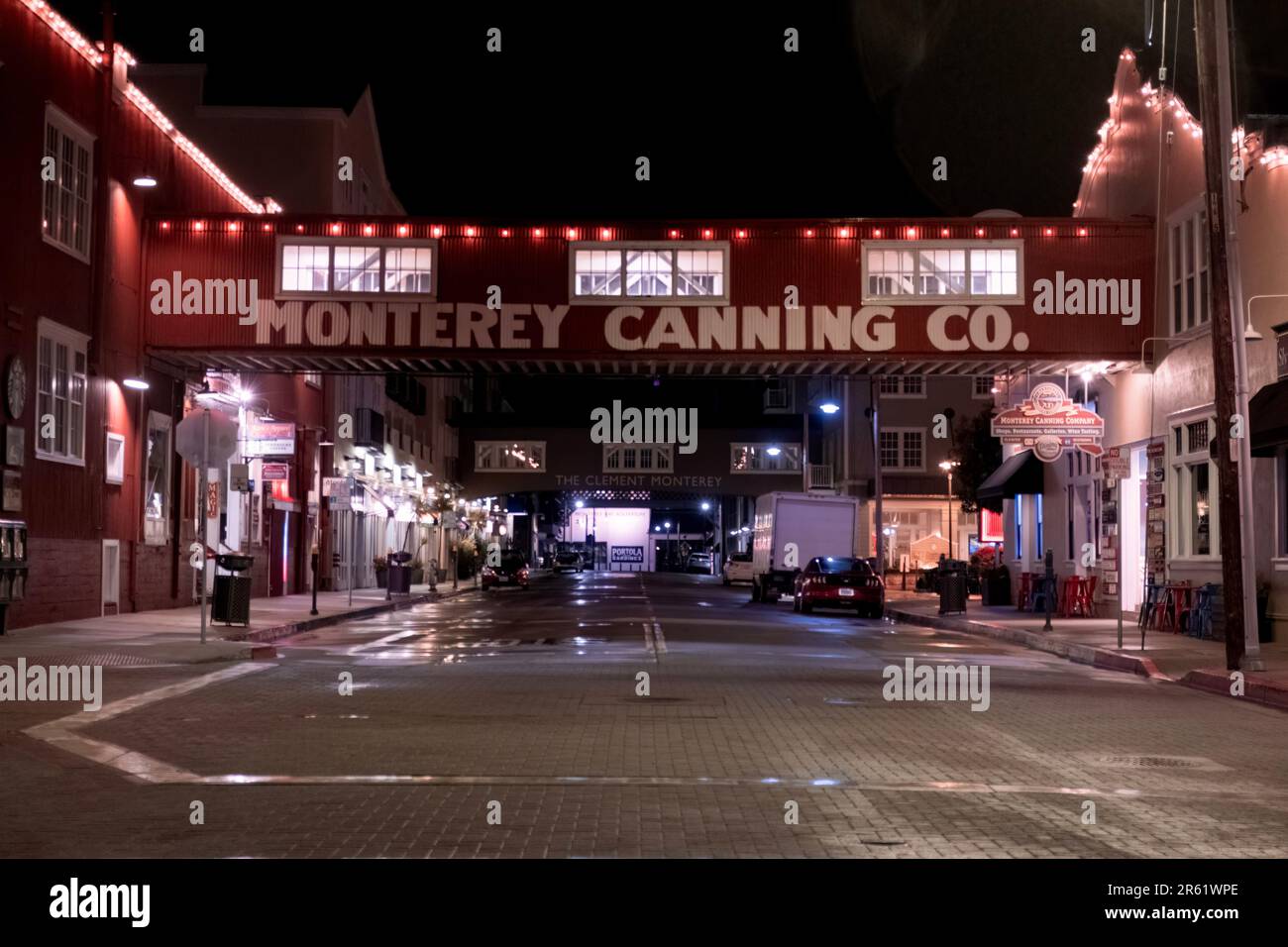 A vibrant nightscape of a bustling city street, illuminated by a ...