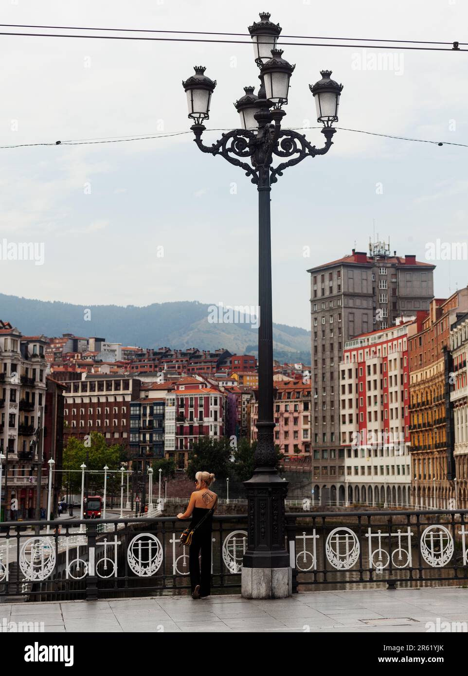 Bilbao, Spain - August 03, 2022: Street lamp and railing on the river ...