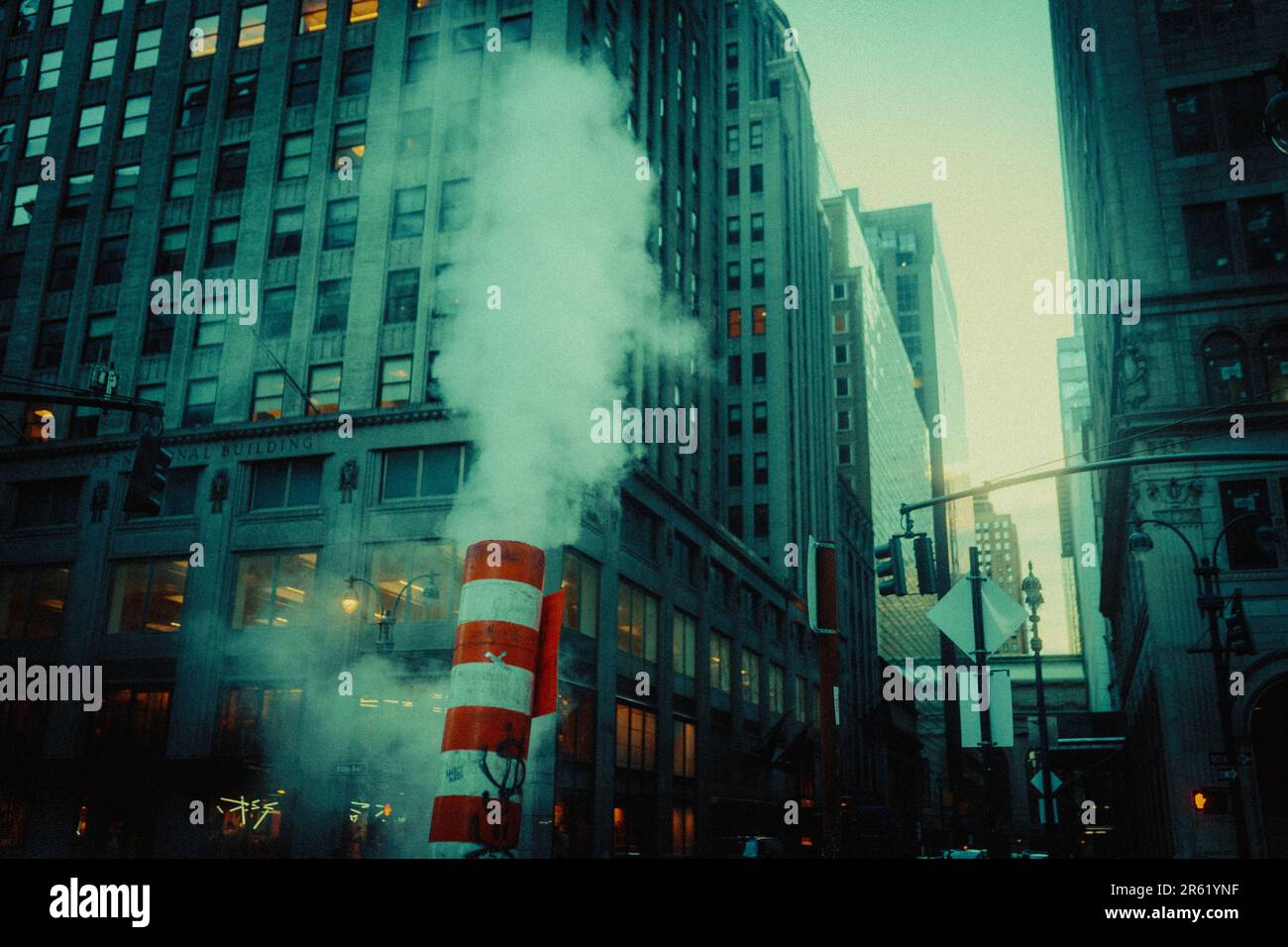 A low-angle shot of New York city buildings with a steam vent Stock ...