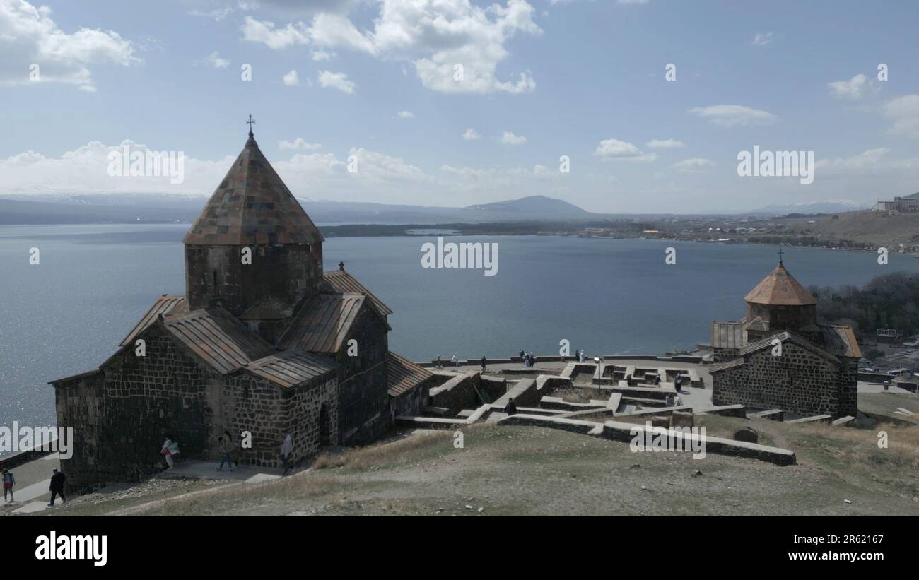 The Sevanank Monastery Complex in Armenia. Monastery buildings with crosses, on the background ...