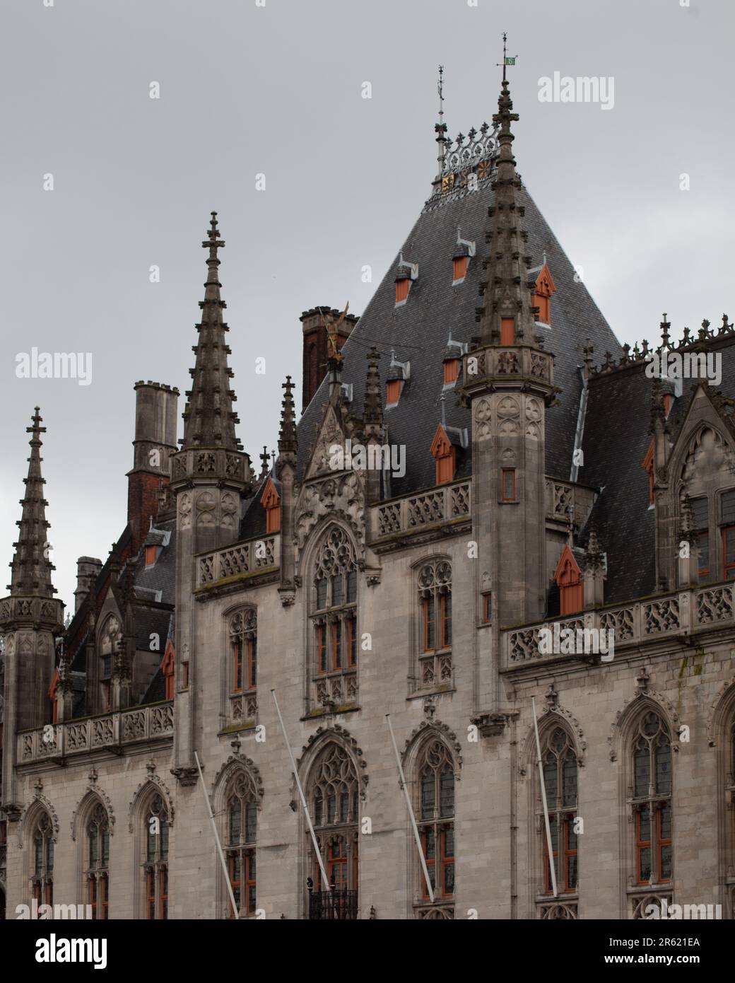 An image of two ornate vintage clock towers with a third clock tower in ...