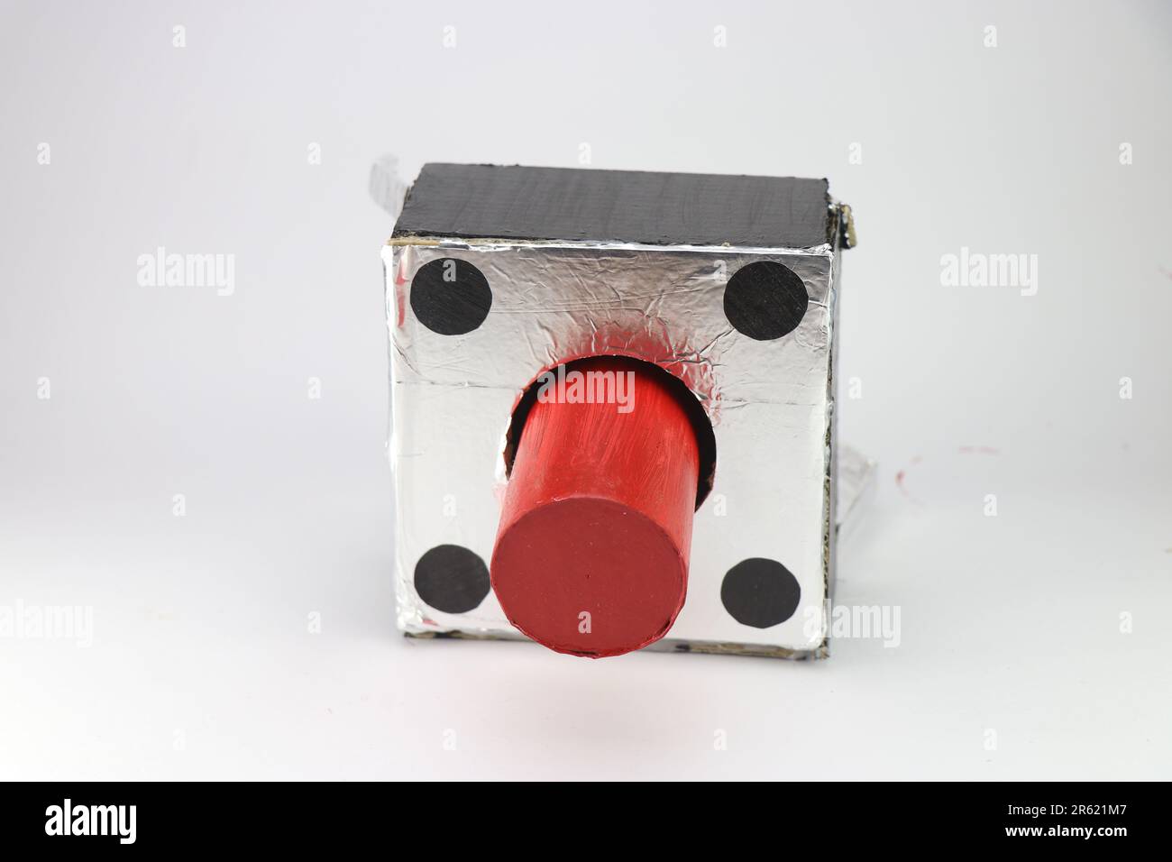 Tactile push button of a very large size made from cardboard and paper ...