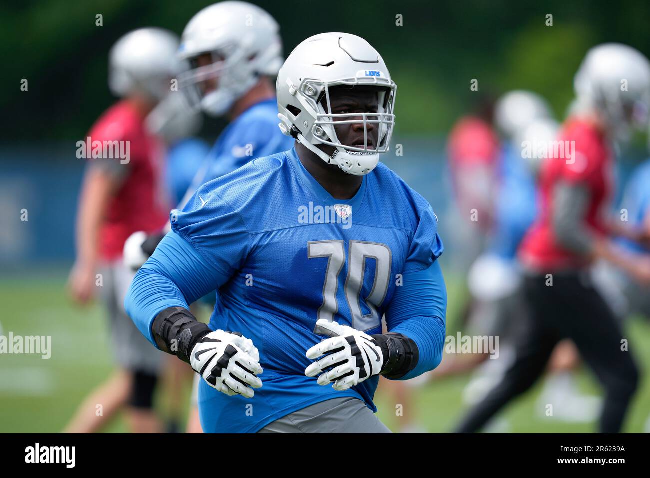 Detroit Lions offensive lineman Germain Ifedi stretches during an NFL ...