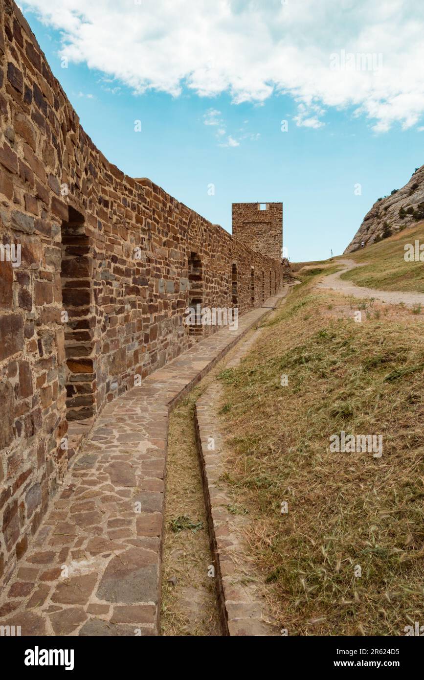 Ancient broken sandstone wall and ble sky Stock Photo - Alamy
