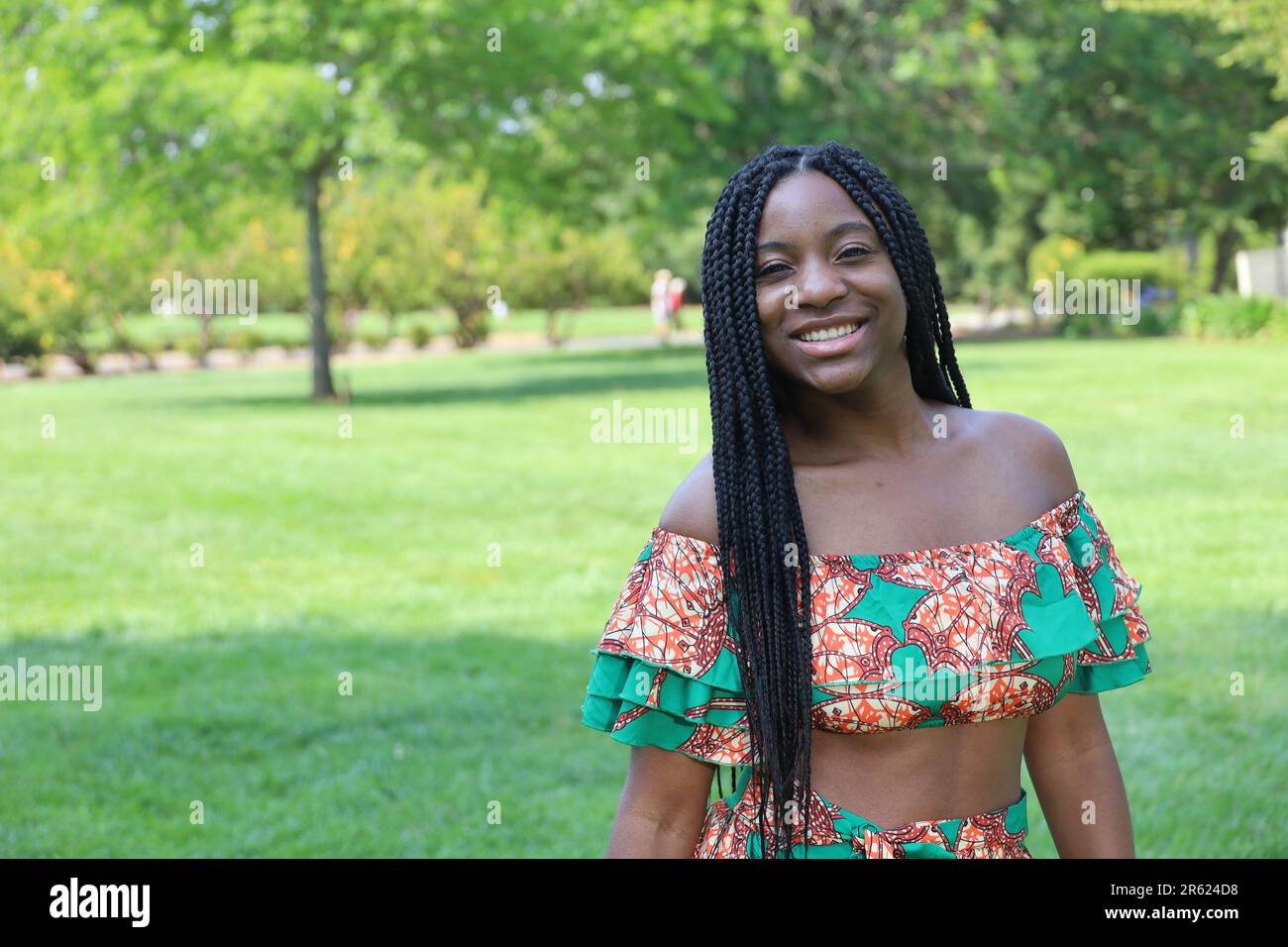 Beautiful Black lady posing in a park Stock Photo - Alamy