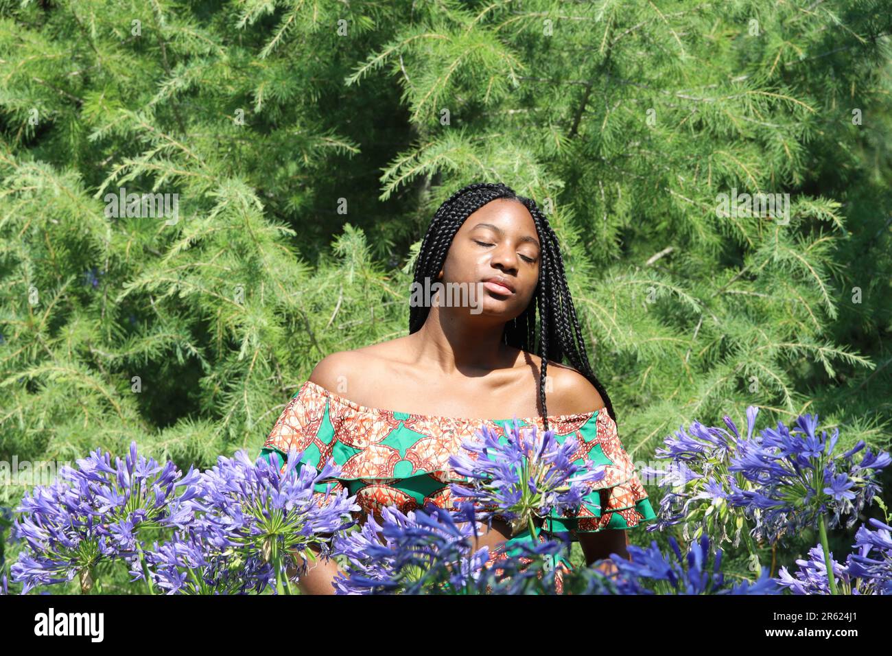 Beautiful Black lady posing in a park Stock Photo - Alamy