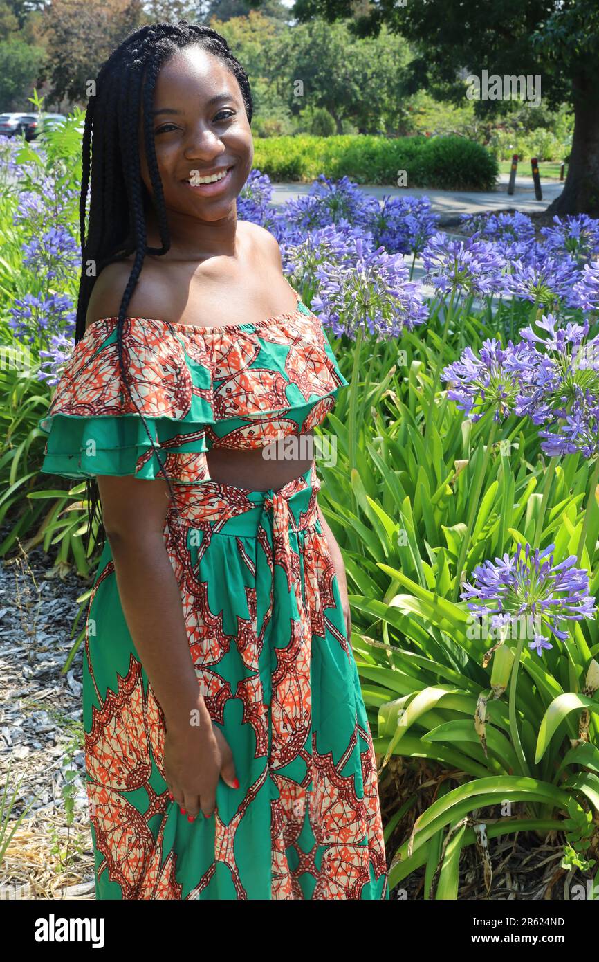 Beautiful Black lady posing in a park Stock Photo - Alamy